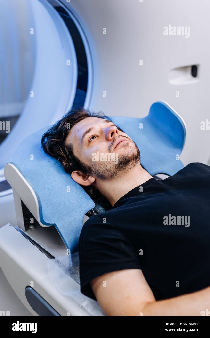 An MRI machine is positioned in a hospital, showcasing advanced imaging technology. This ...