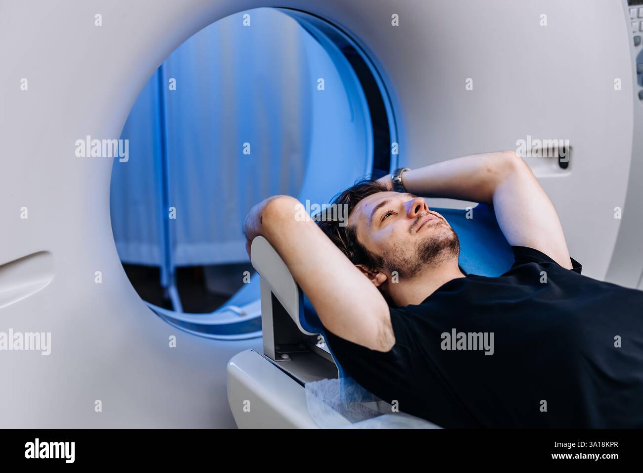 An MRI machine is positioned in a hospital, showcasing advanced imaging technology. This ...