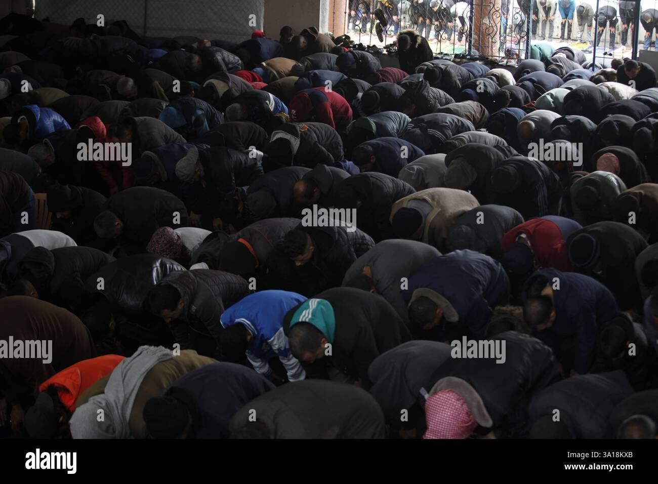 Palestinians gather inside a war-damaged mosque to perform the Friday ...
