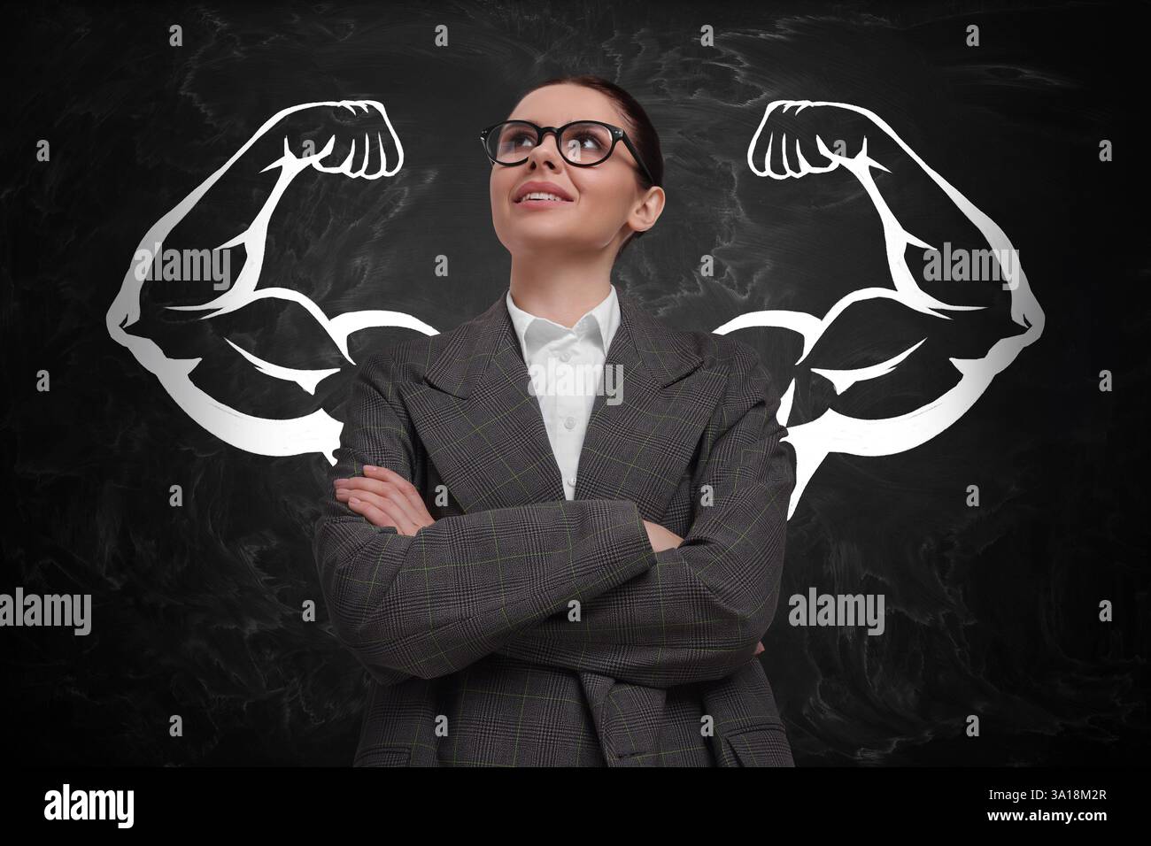 Confident business woman with drawing of strong arms behind her on ...