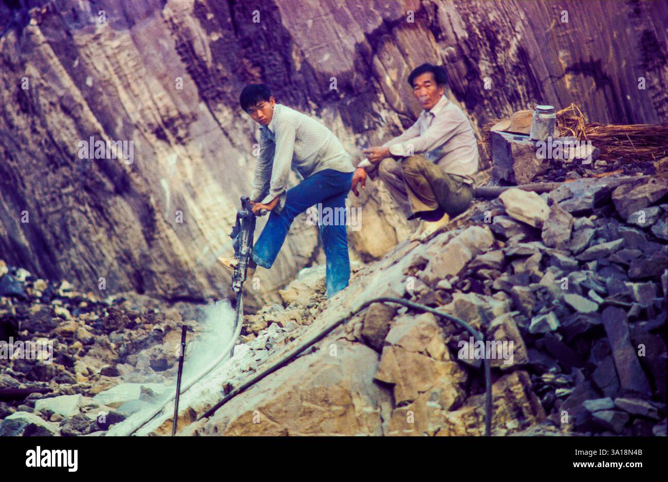 Malaysia, men drilling in a tin mine Stock Photo - Alamy
