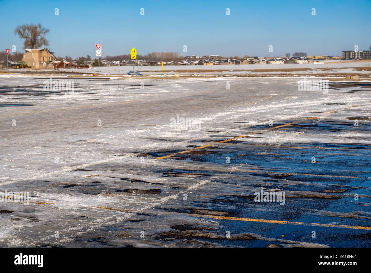 Snow covered parking lot with the lines covered in some locations Stock ...