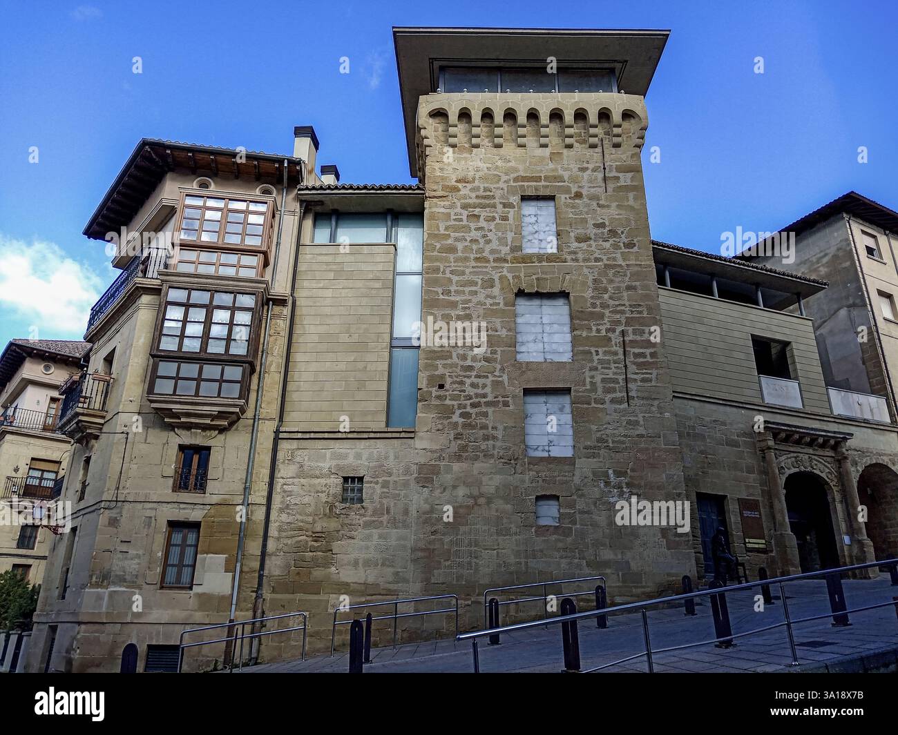 Ancient stone tower with crenellations, blending medieval and modern ...