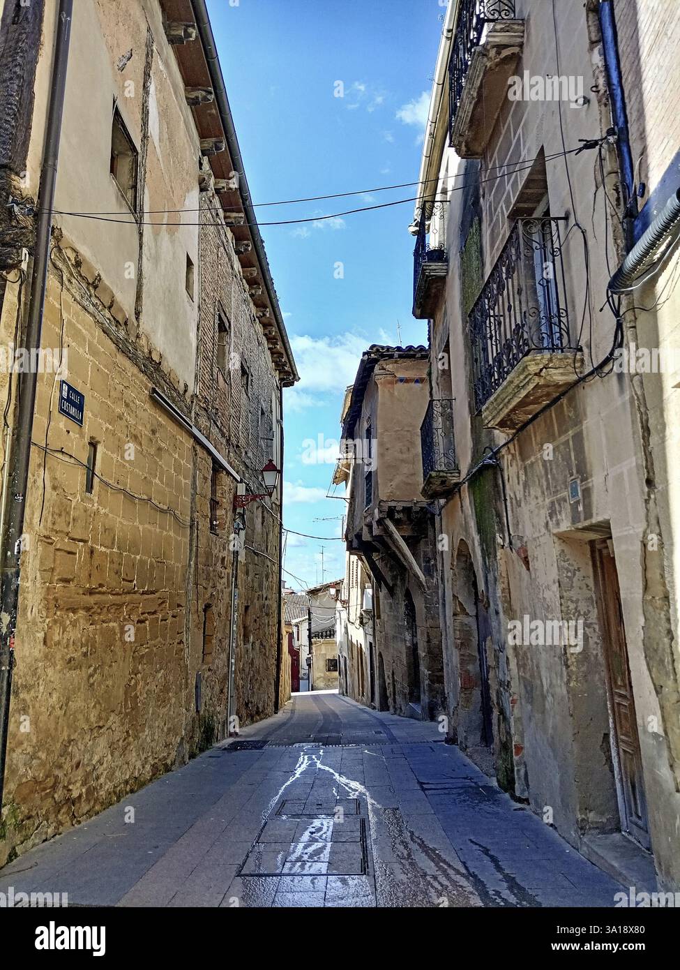 Narrow historic street in Haro, Spain, featuring timber-framed houses ...