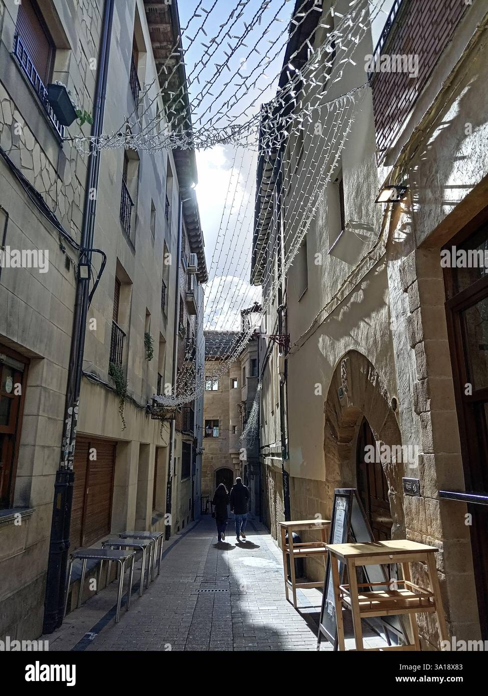 Narrow historic street in Haro, Spain, featuring timber-framed houses ...