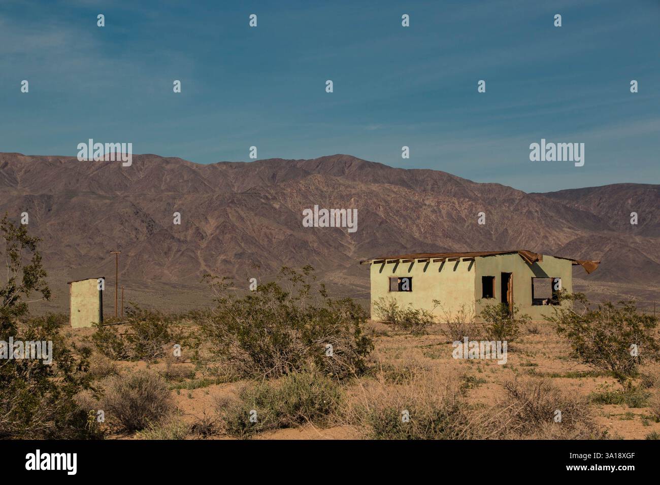 An old abandoned homestead shack with outhouse, built to claim land in ...