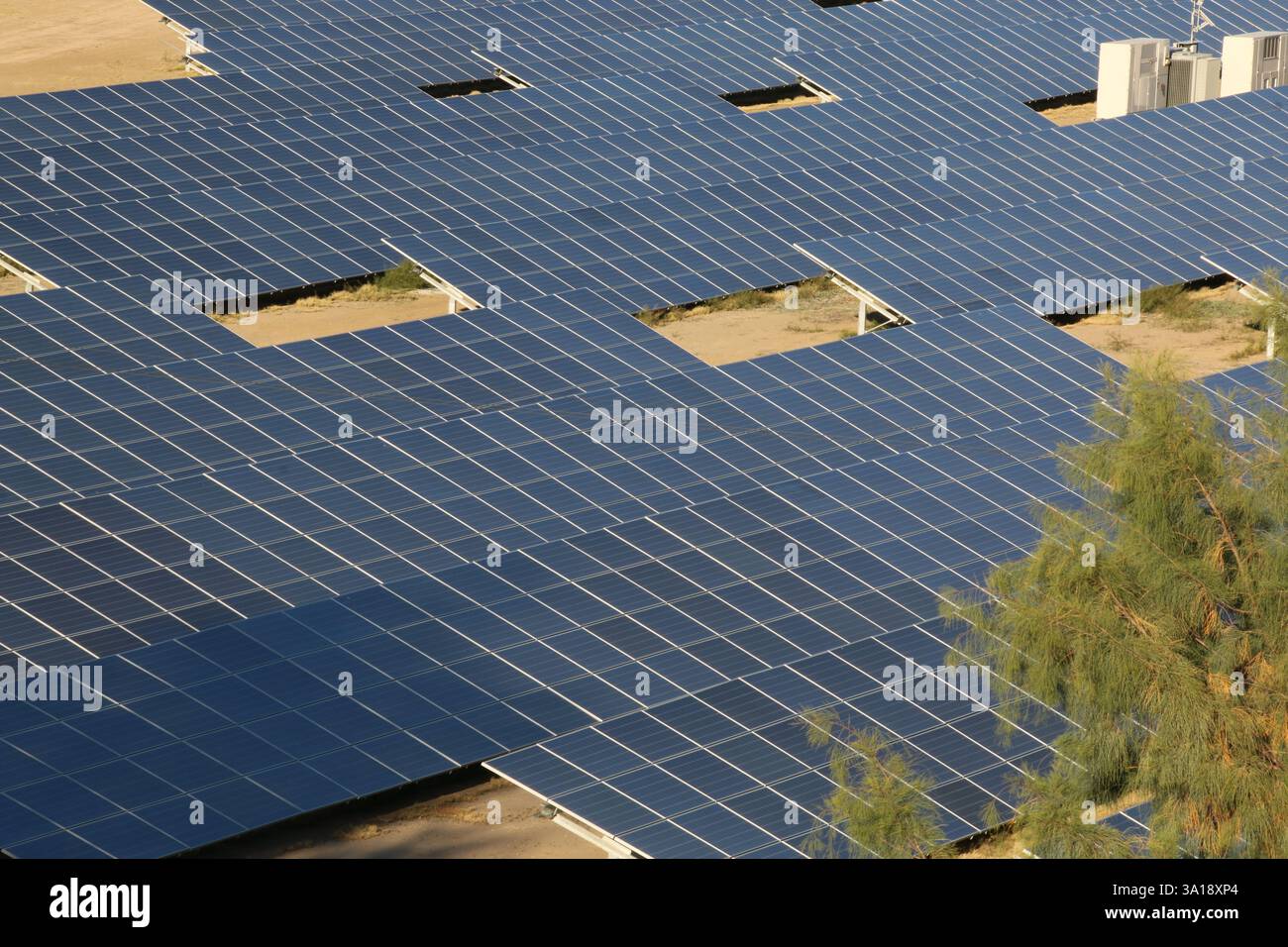 Solar panels generating electricity in the sunny desert Stock Photo - Alamy