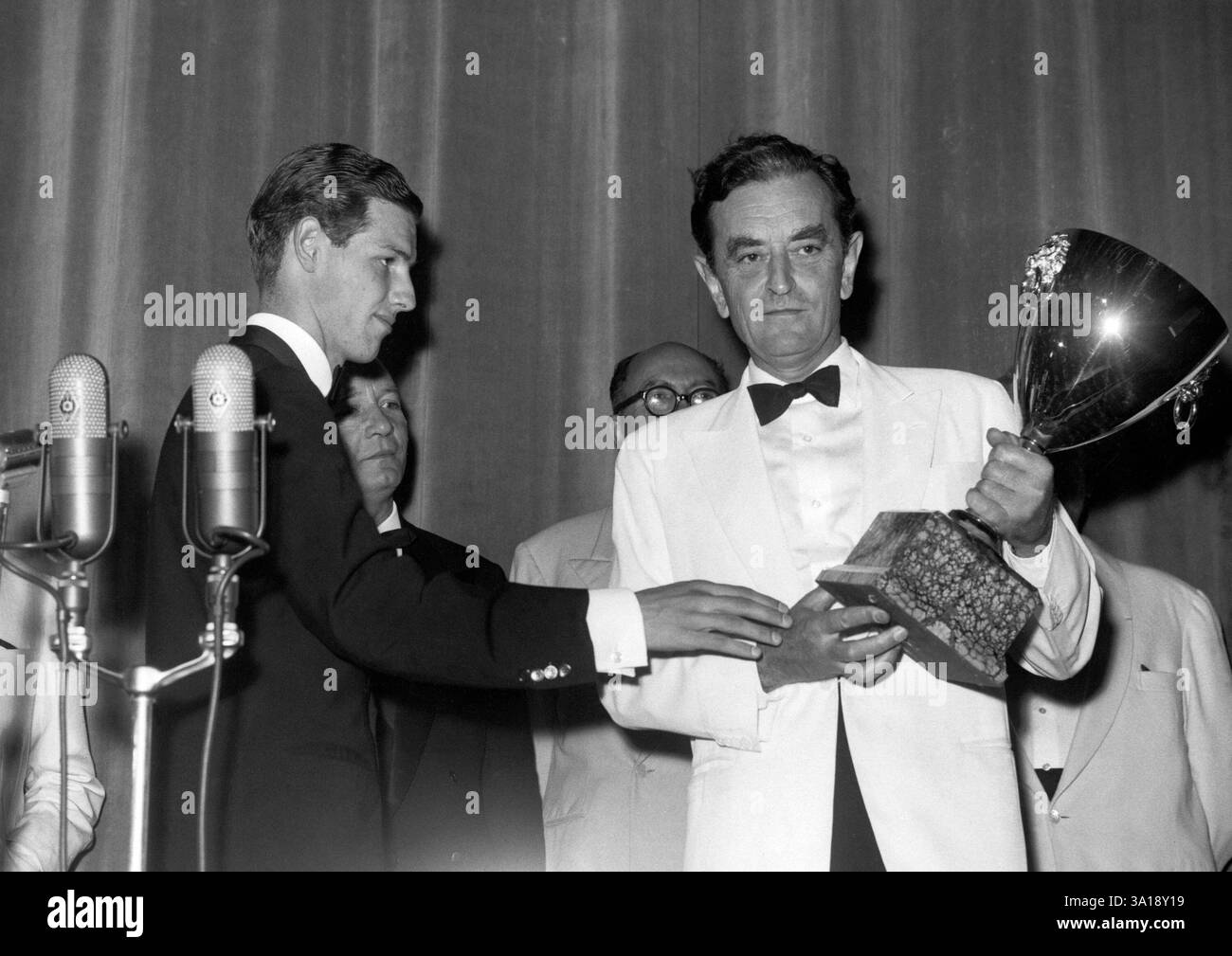 Count Giovanni Volpi di Misurata, left, hands the Volpi Cup to British ...