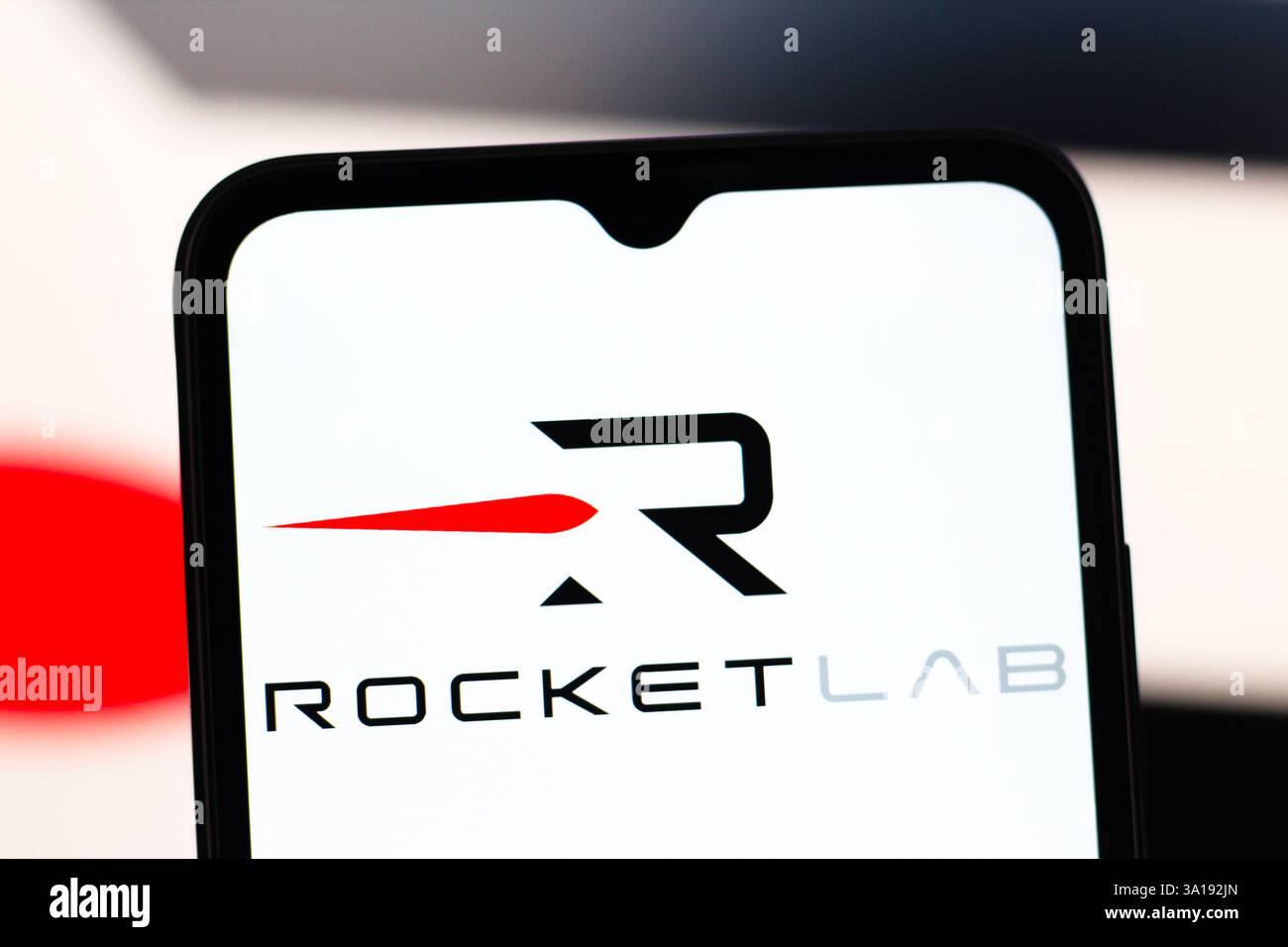 In this photo illustration, the Rocket Lab logo is seen displayed on a ...