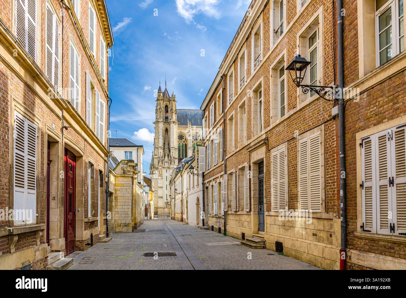 Narrow pedestrian street in old historical city centre with cobblestone ...