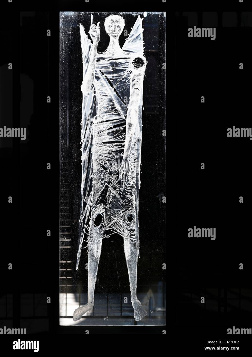 Depiction, of an angel pointing up and down, on the etched west glass ...