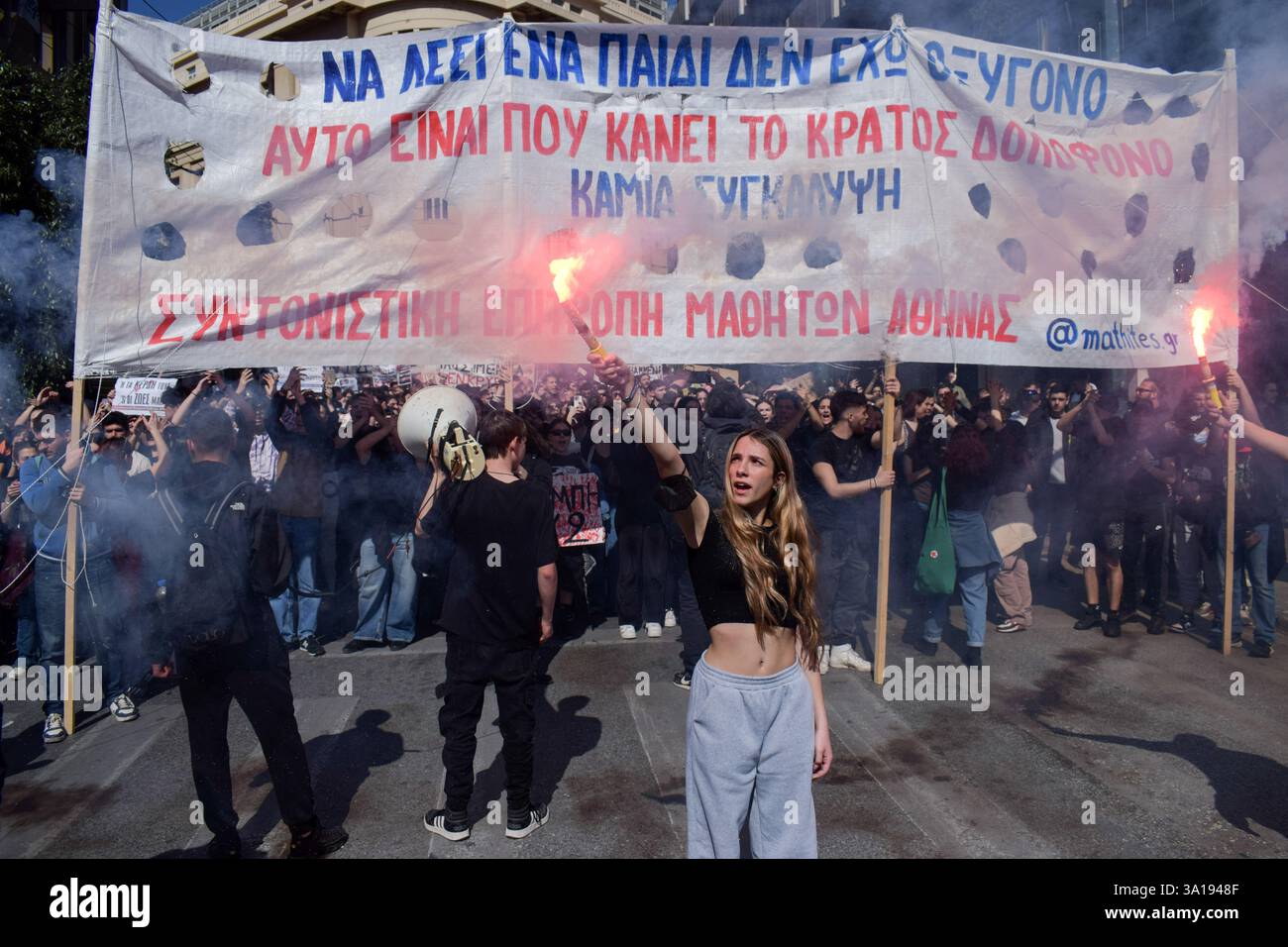 Athens, Greece, 7 March 2025. light flares and shout slogans during a ...