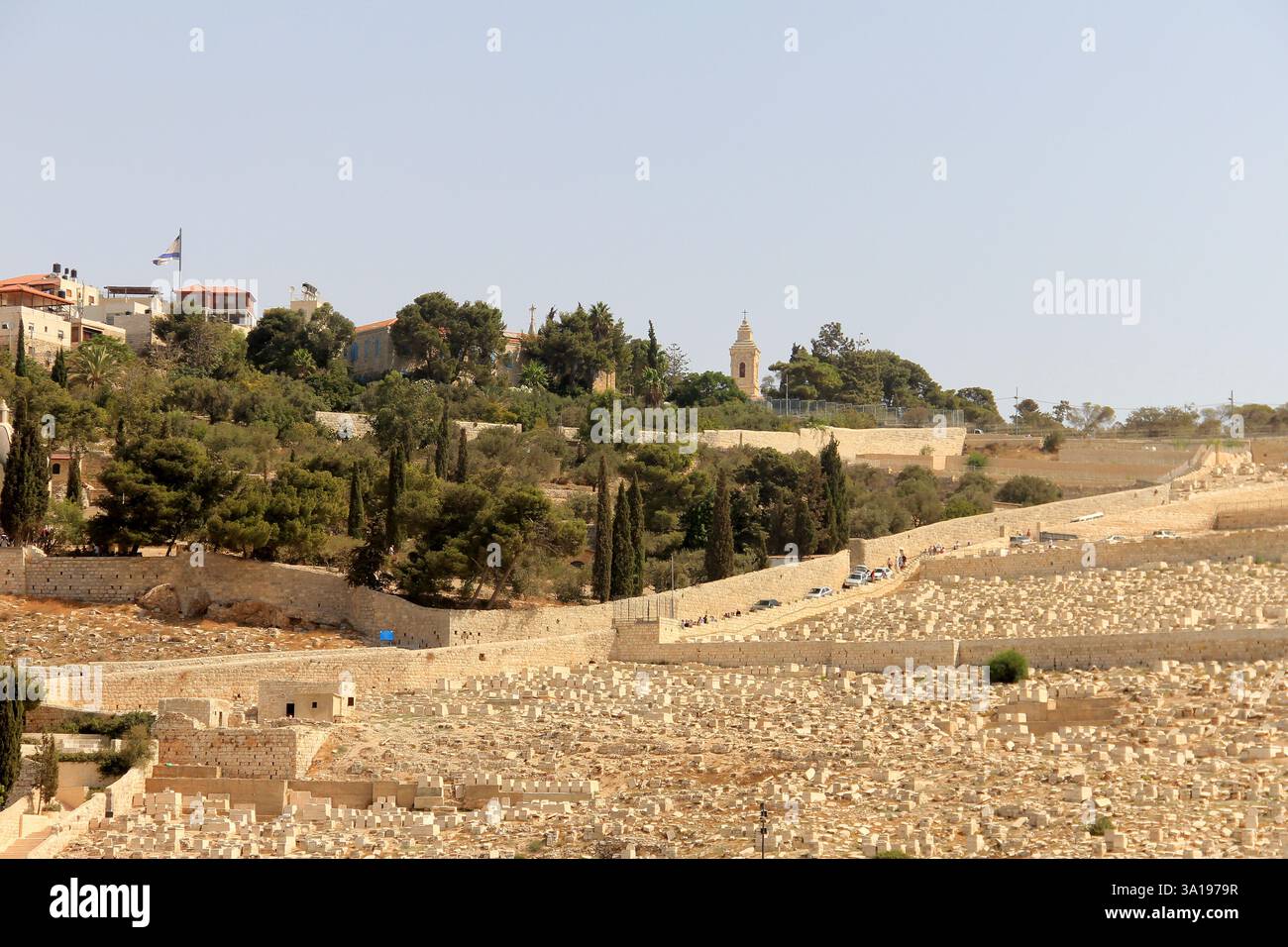 Landscape featuring vast historic cemetery with stone tombstones and ...