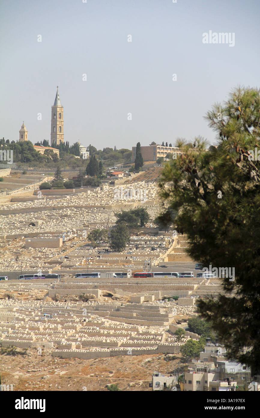 Landscape featuring vast historic cemetery with stone tombstones and ...