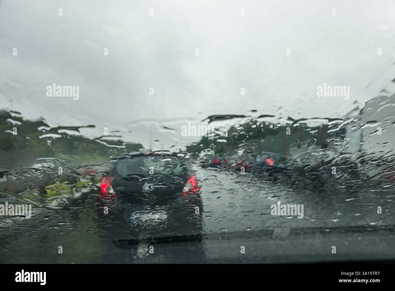 Raindrops on windshield car road hi-res stock photography and images ...