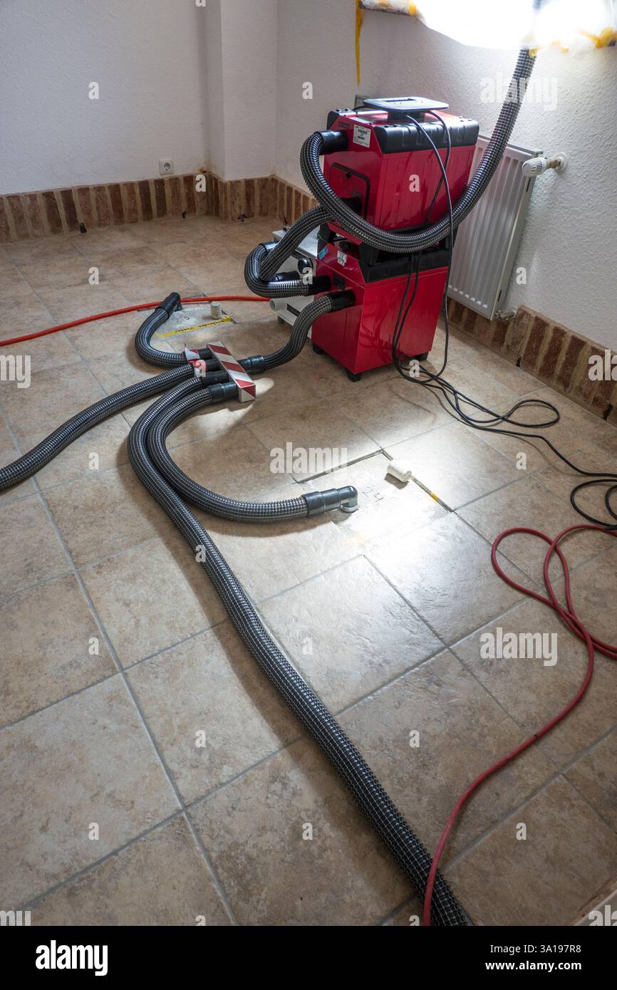 Wet screed is dried in a special process hi-res stock photography and ...