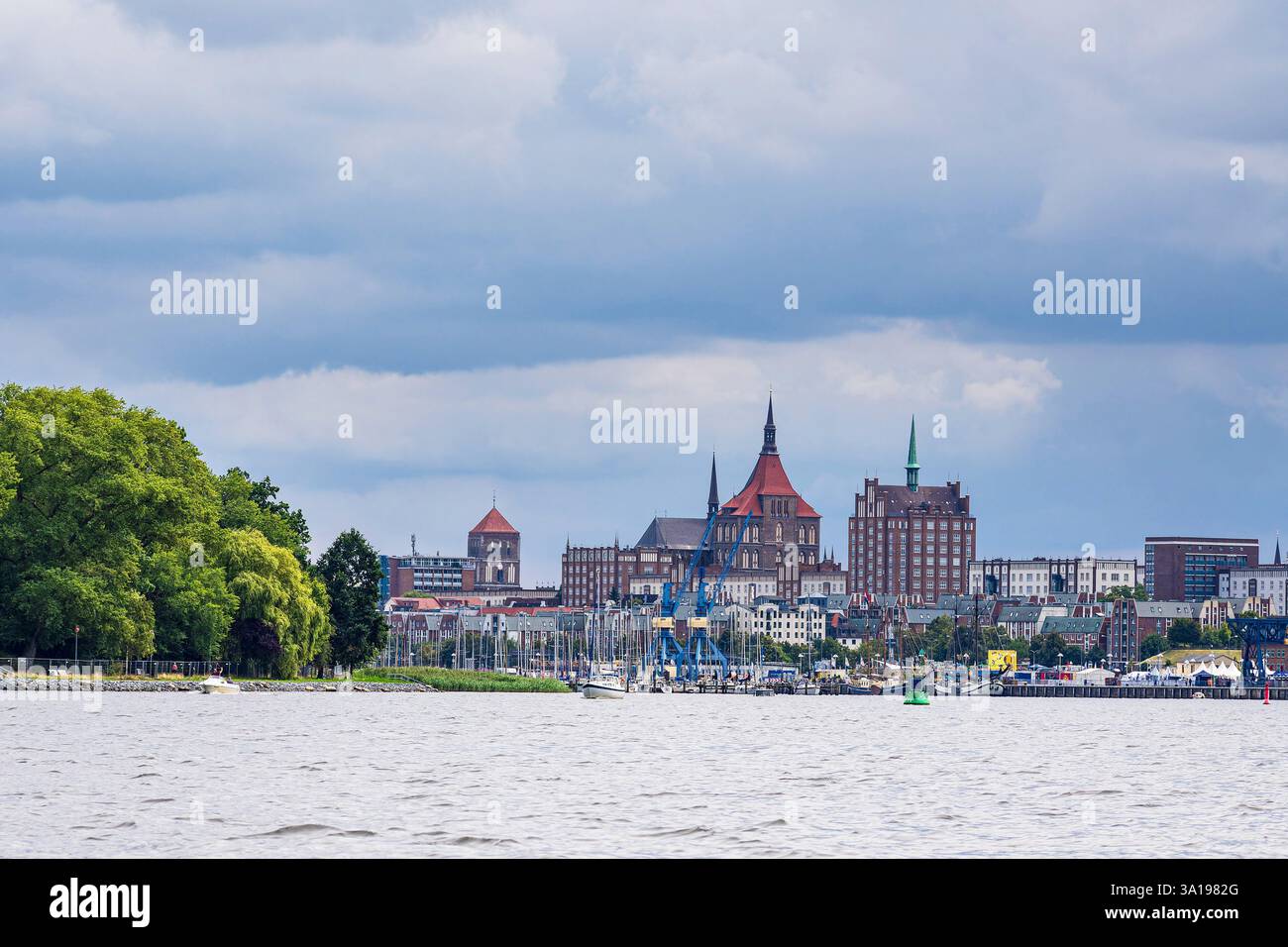 View over the Warnow river to the Hanseatic city of Rostock Stock Photo ...