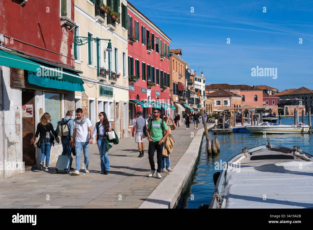Venice, Italy - 12 October 2024: Tourists stroll along Murano’s lively ...
