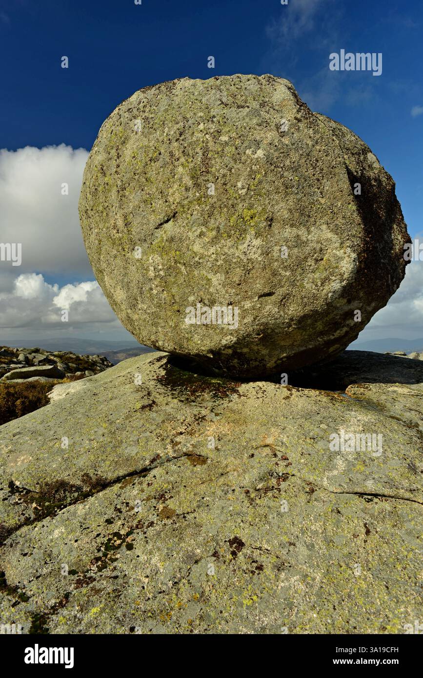 Huge granite rock of rounded shape balanced on another one Stock Photo ...