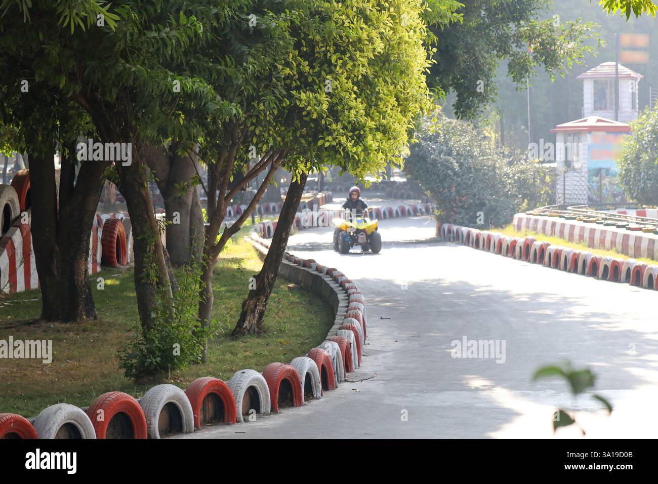 Speeding into fun—a young racer enjoys the thrill of go-karting in the ...