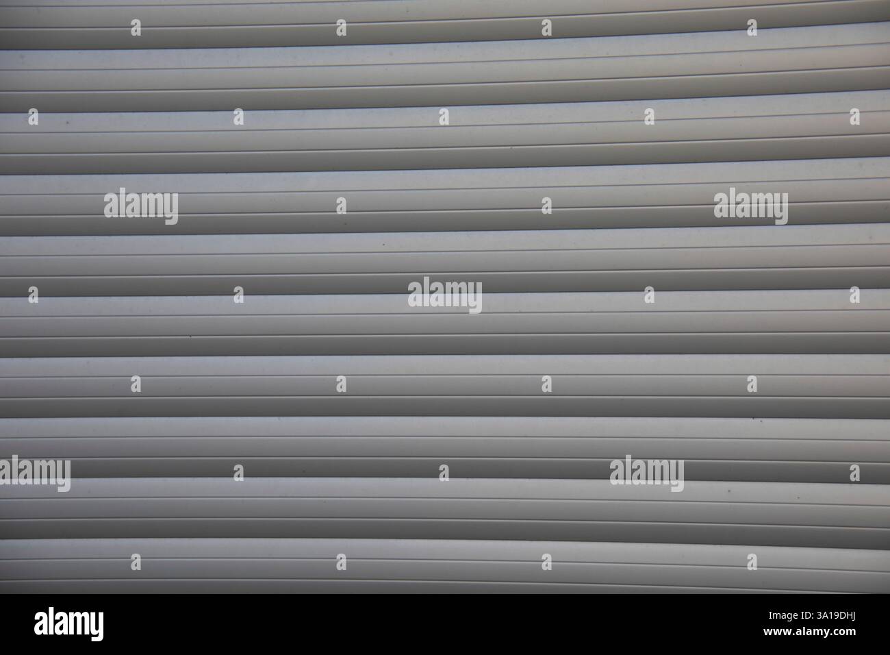 Industrial door with movable steel slats Stock Photo - Alamy