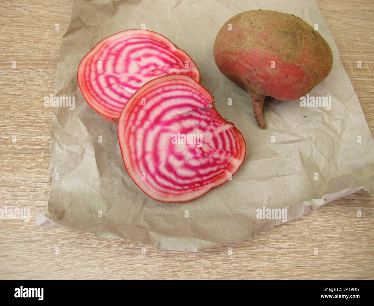 One whole and one halved Chioggia ringlet on paper Stock Photo - Alamy