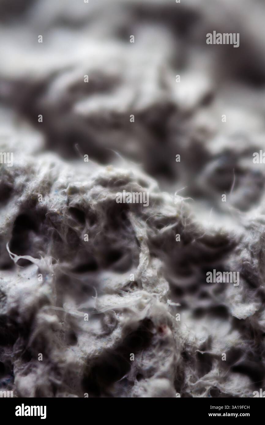 Extreme close up of old gray handmade paper clay with a structure and ...