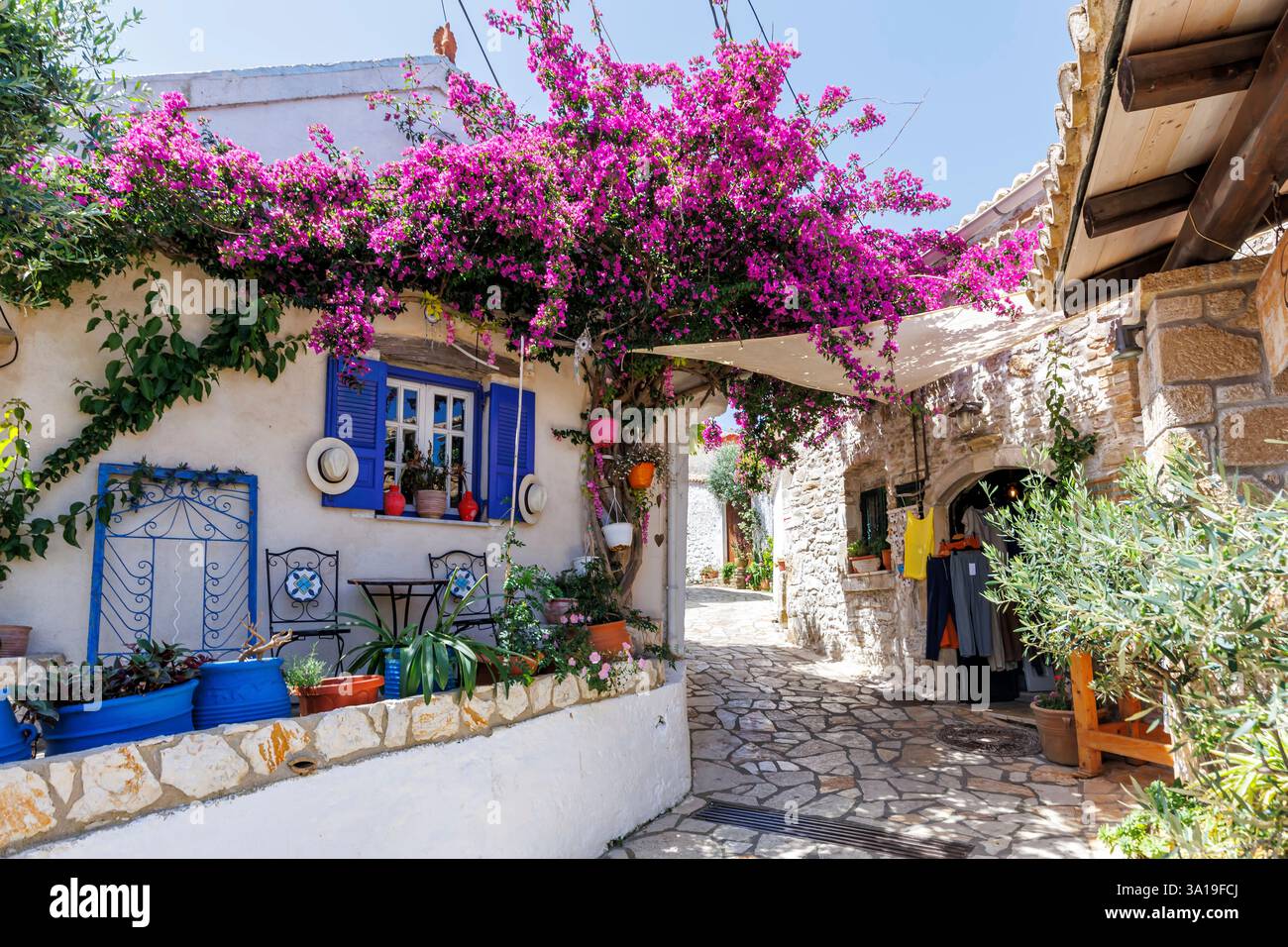 Corfu, Greece, Alley decorated with flowers in the picturesque village ...