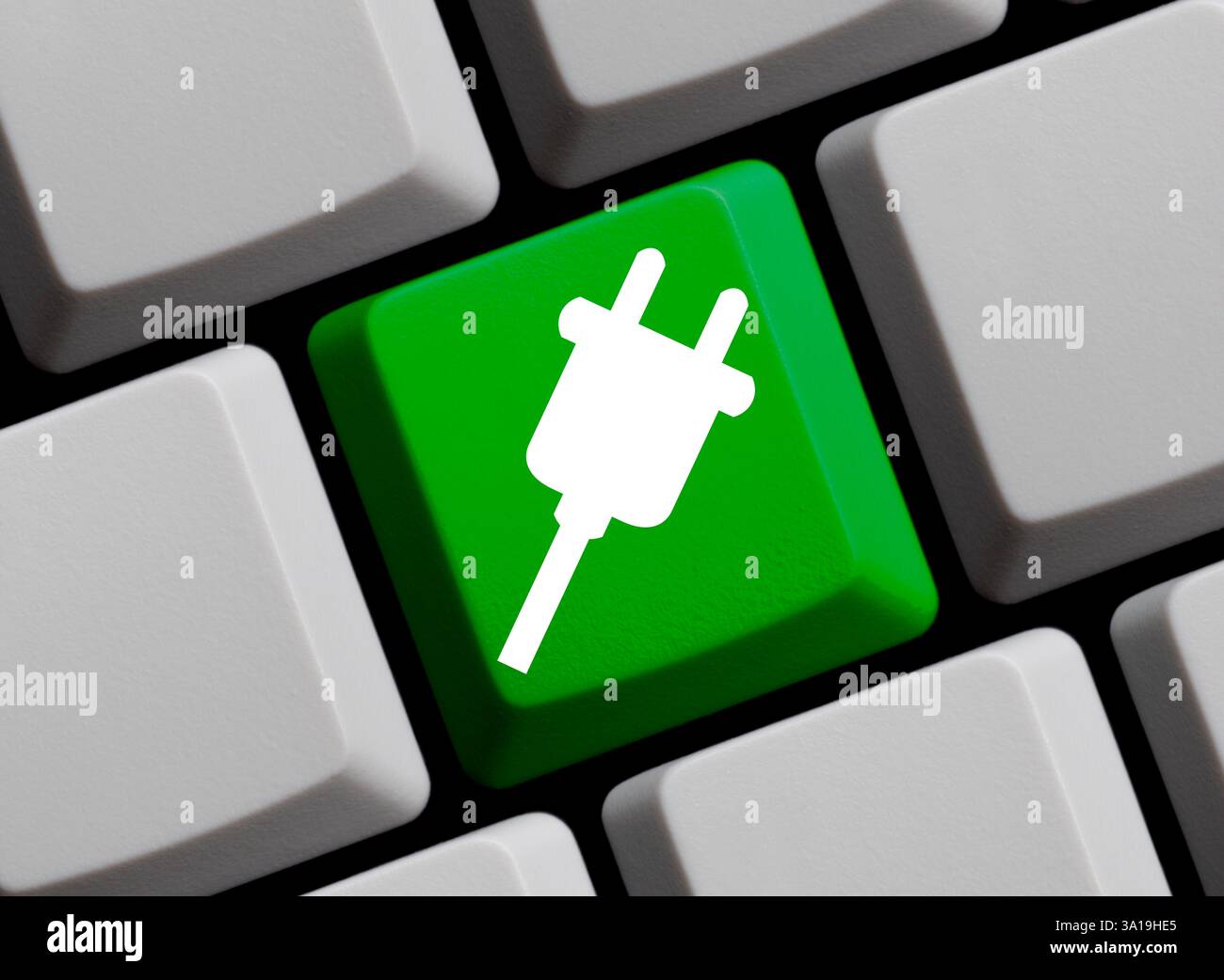 Green keypad with plug symbol Stock Photo - Alamy