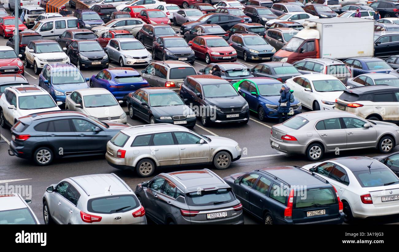 Belarus, Minsk - 02.01.2025: Numerous cars are parked along the side of ...