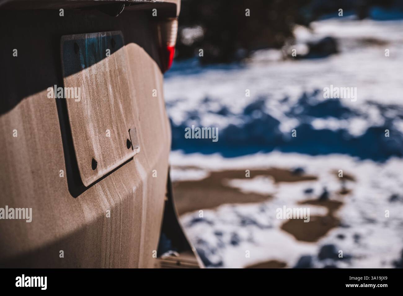Mud and dust covered vehicle license plate from a gravel road Stock ...