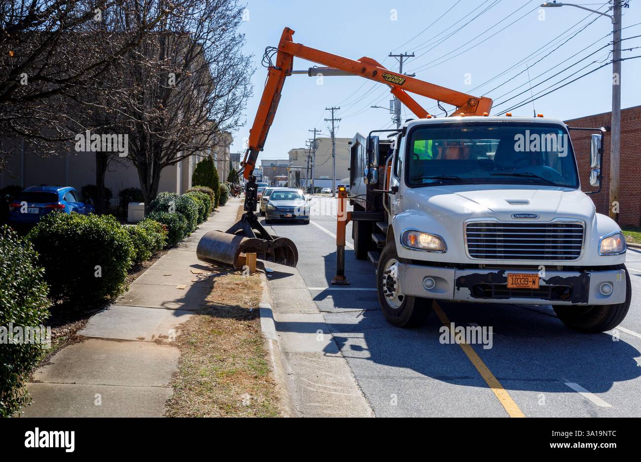 High Point, North Carolina-3 March 25: A trash truck with hydraulic arm ...