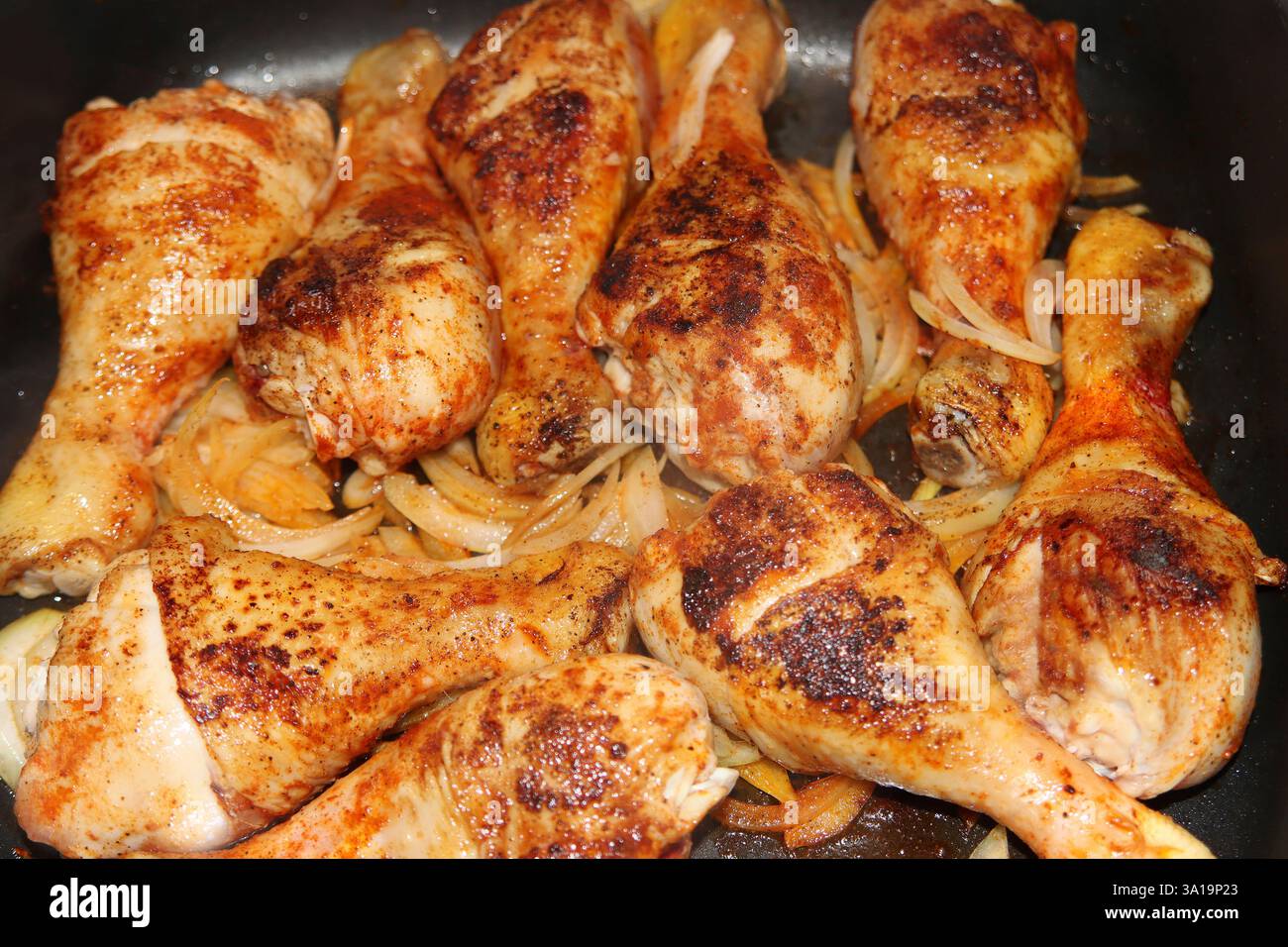 Sauteed chicken drumsticks Stock Photo - Alamy