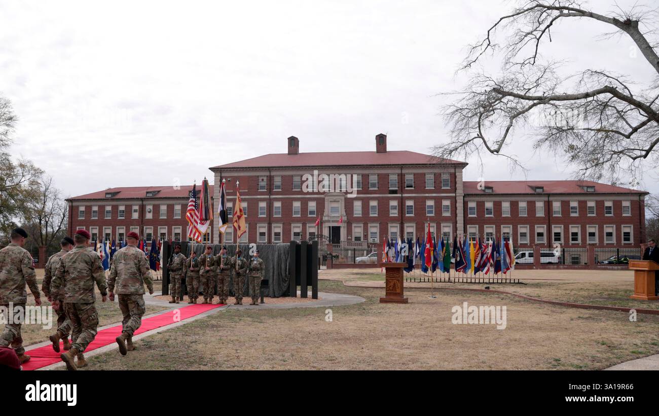 A color guard stands in front of the headquarters building as Fort ...
