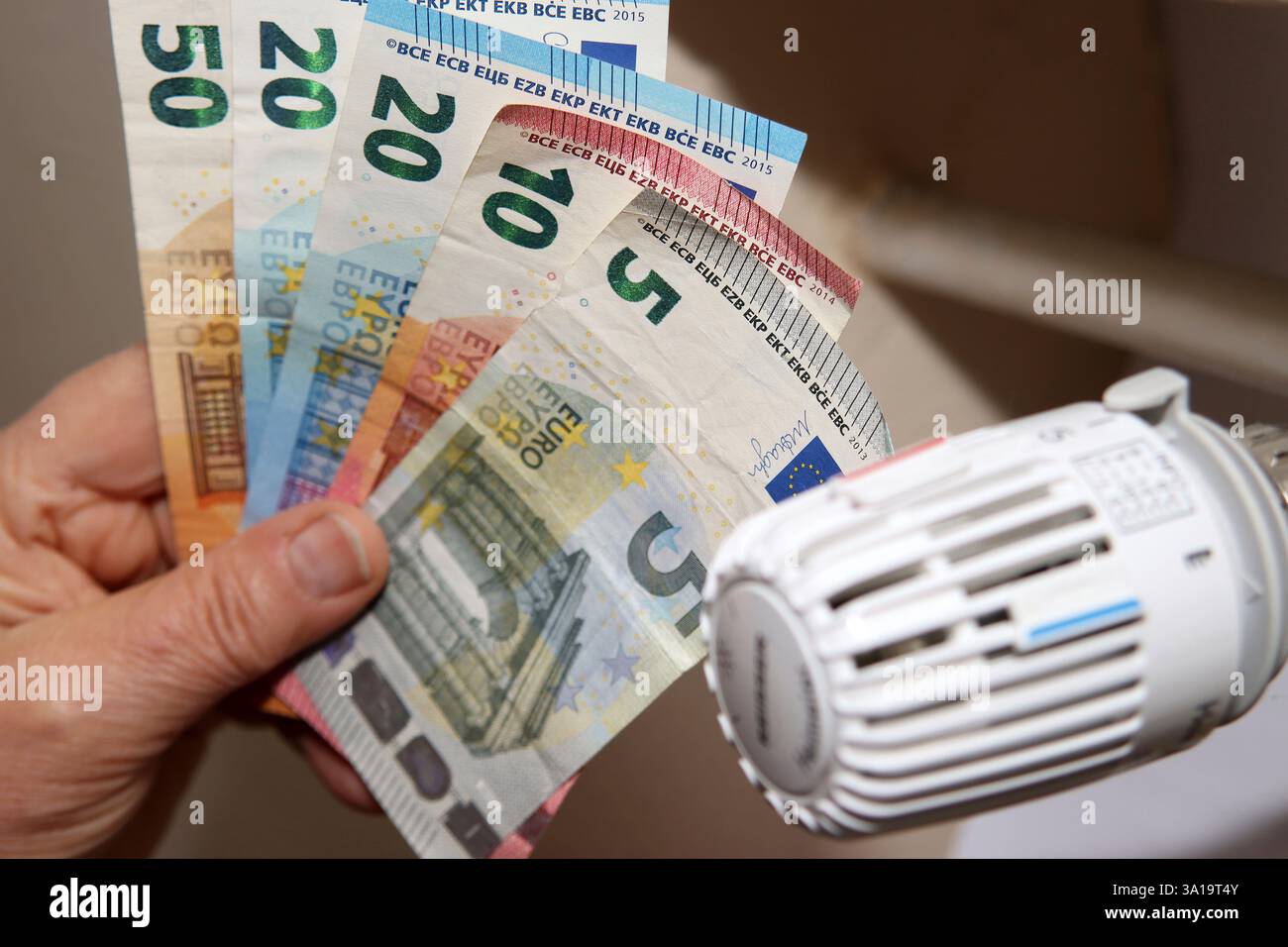 Thermostat heater euro bills hi-res stock photography and images - Alamy
