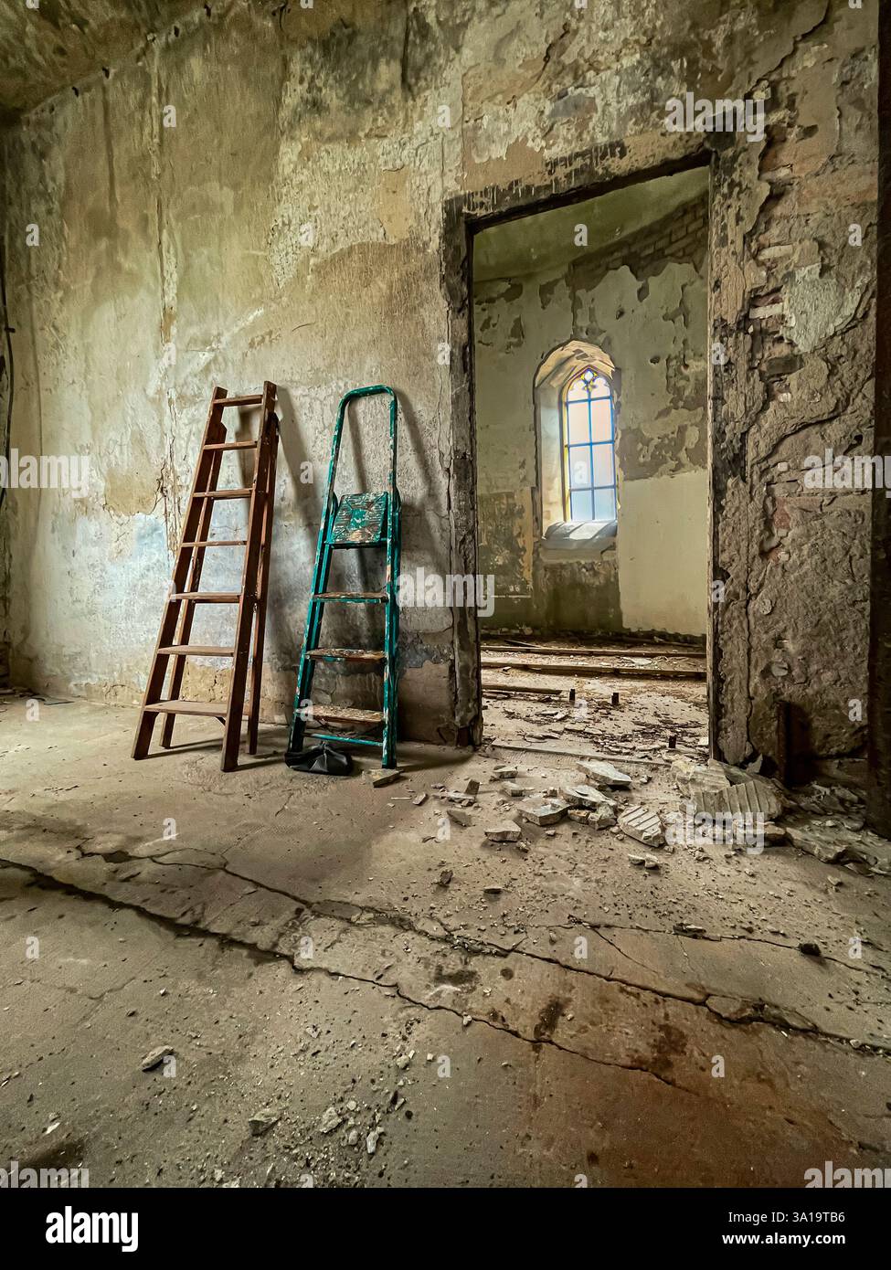 Two stepladders in a dilapidated room in need of renovation Stock Photo ...
