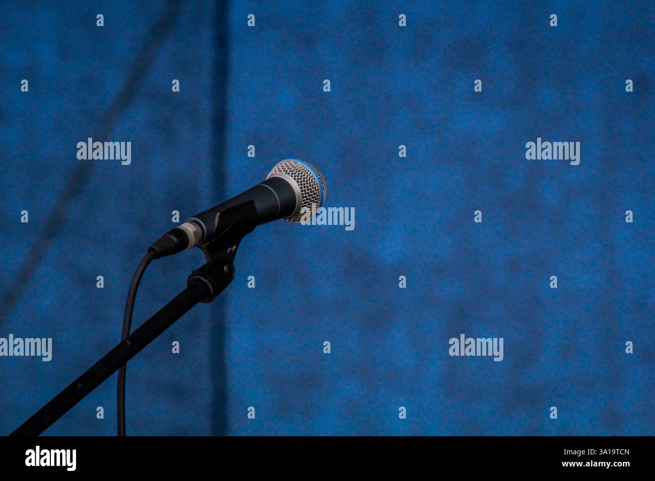 Microphone on a stage Stock Photo - Alamy