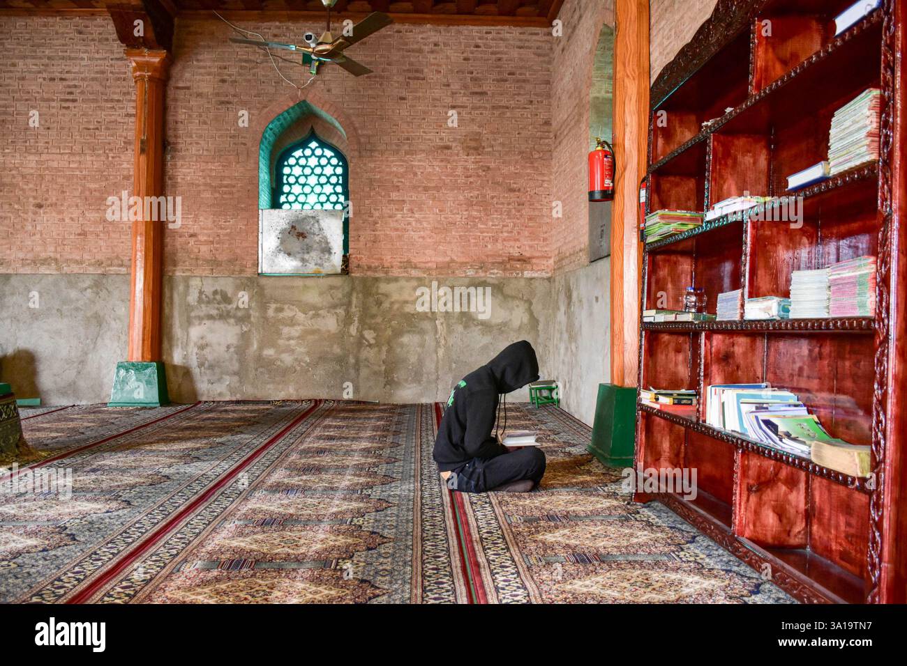 Shopian, India. 07th Mar, 2025. A Kashmiri Muslim recites the holy ...