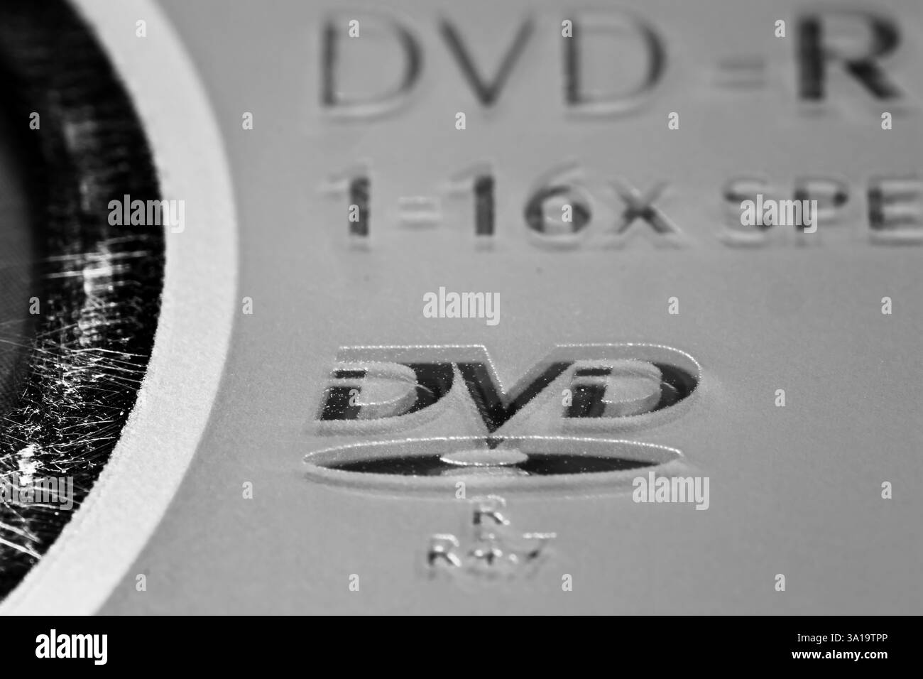 Close up view of DVD text on DVD disc grey tone Stock Photo - Alamy