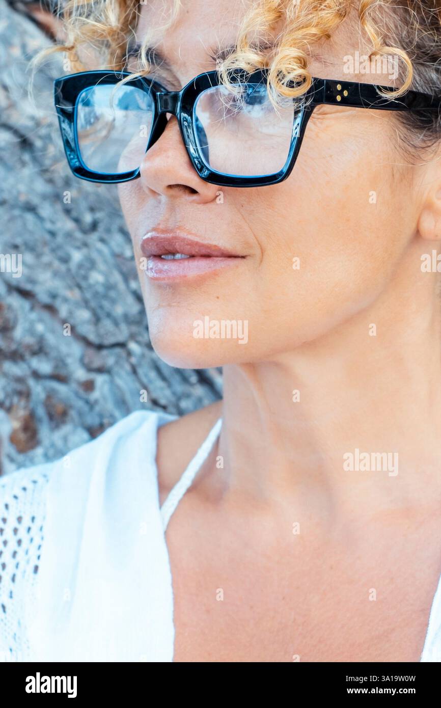 Smiling Mature Woman With A Youthful Appearance Wearing Black Glasses Enjoying A Healthy