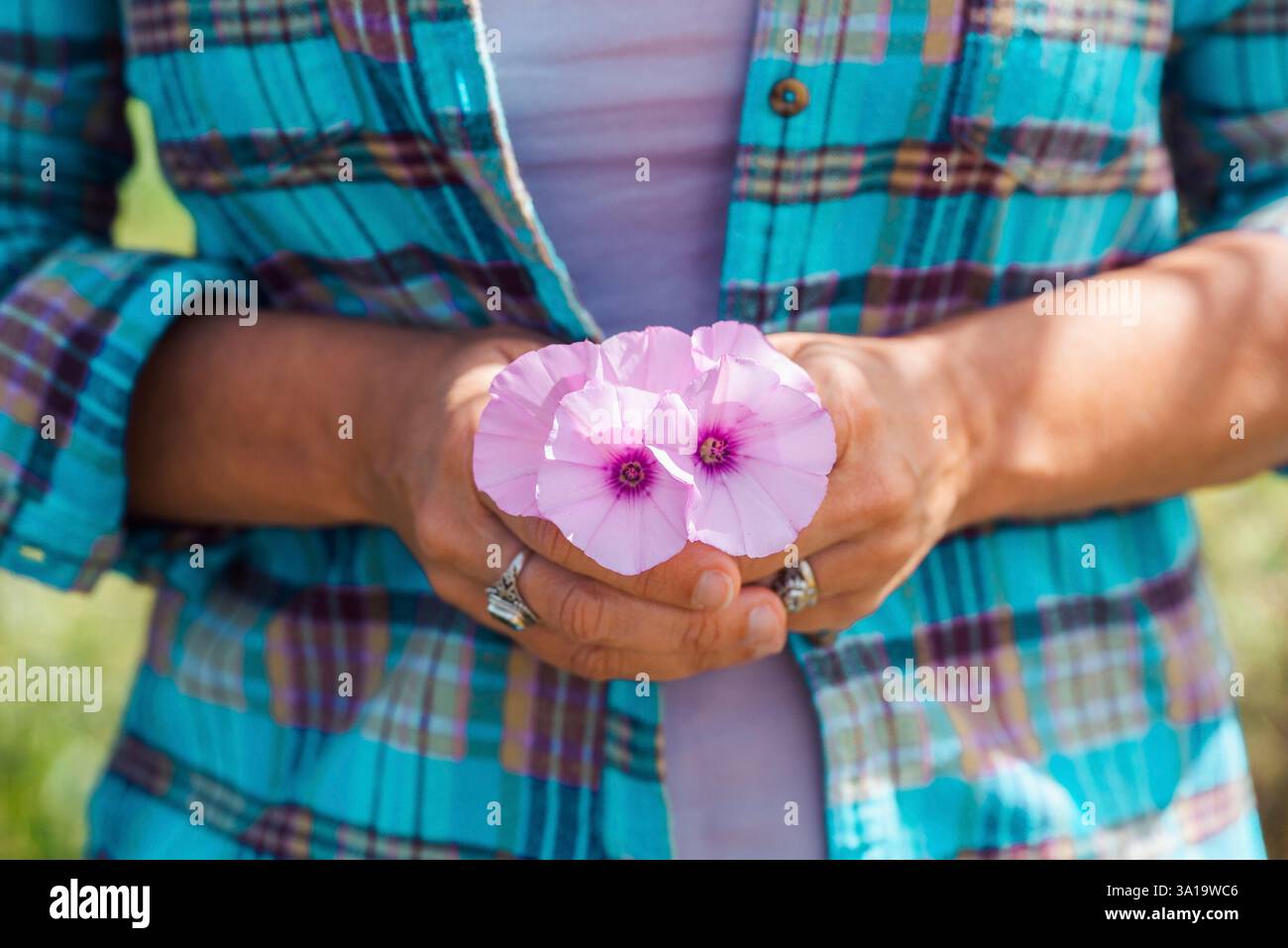 Welcome spring people concept with cut out unrecognizable womanholding ...