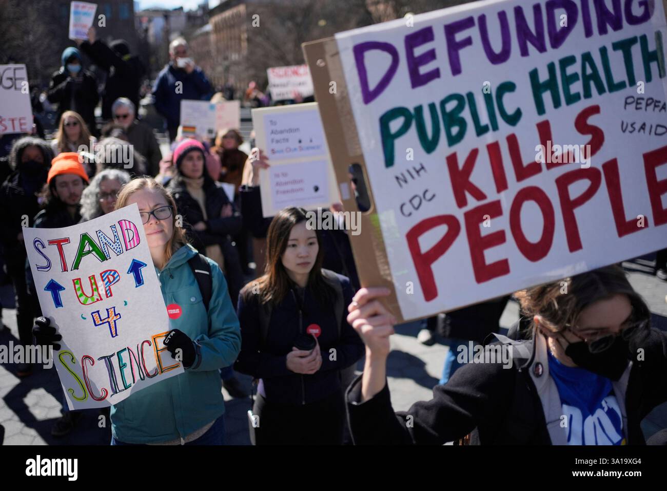 People participate in a "Stand Up for Science" rally in New York ...