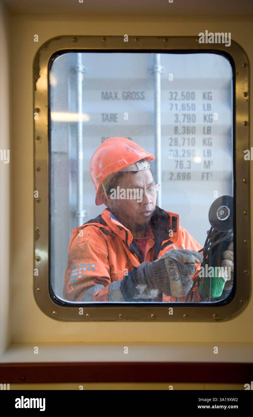 Able Seaman / Seafareer doing Maintenance. Asian Seafarer / Able Seaman ...