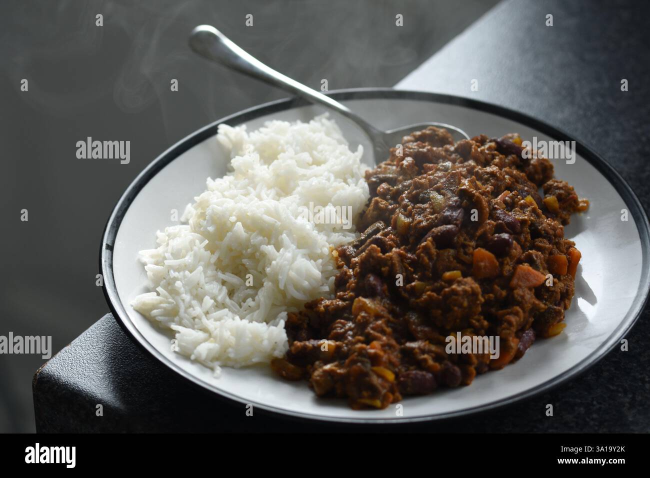 Chili con carne with basmati rice Stock Photo - Alamy