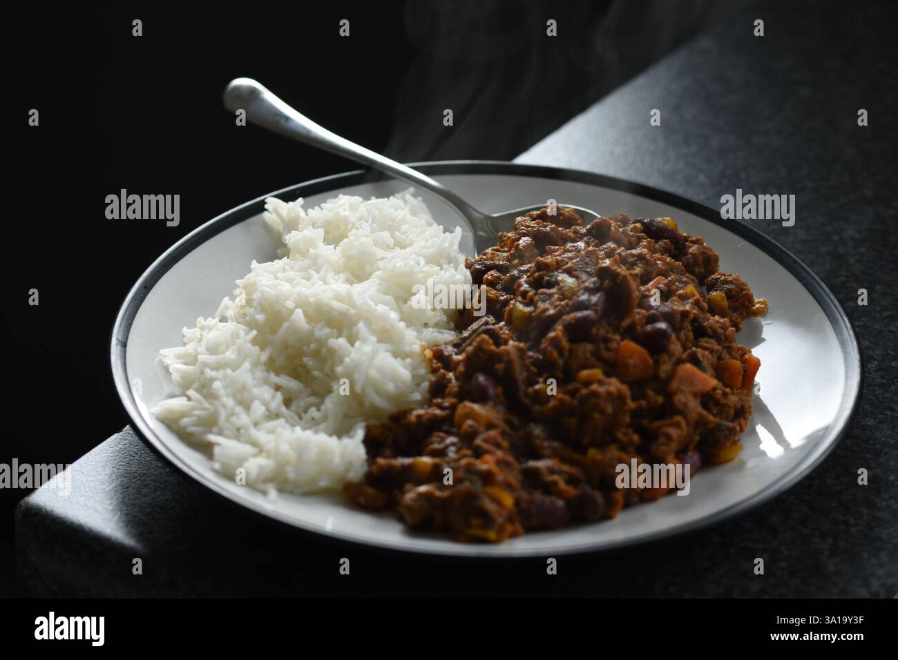Chili con carne with basmati rice Stock Photo - Alamy