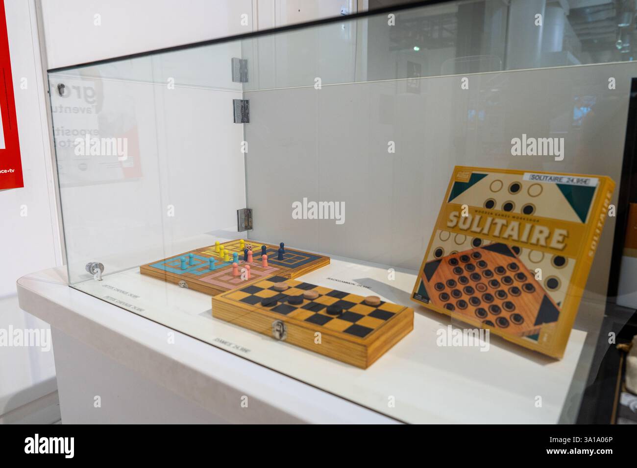 Vintage board games displayed in a glass cabinet at a creative arts ...