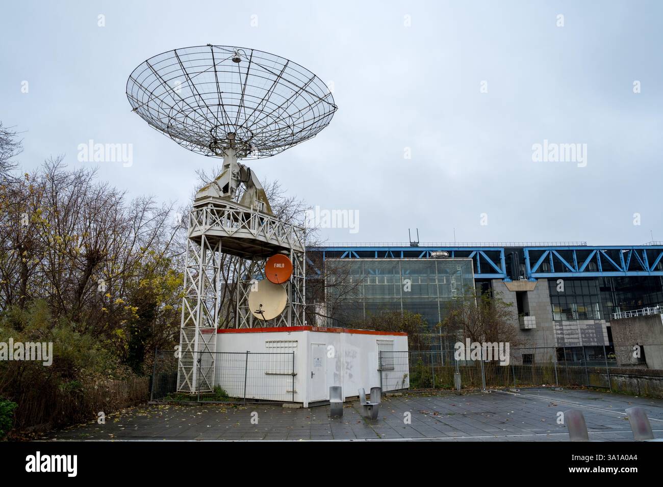 Historic radar tower surrounded by autumn foliage in a serene urban ...