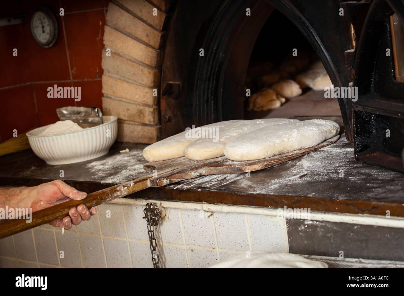 Daily production of bread baked with wood oven with traditional method ...