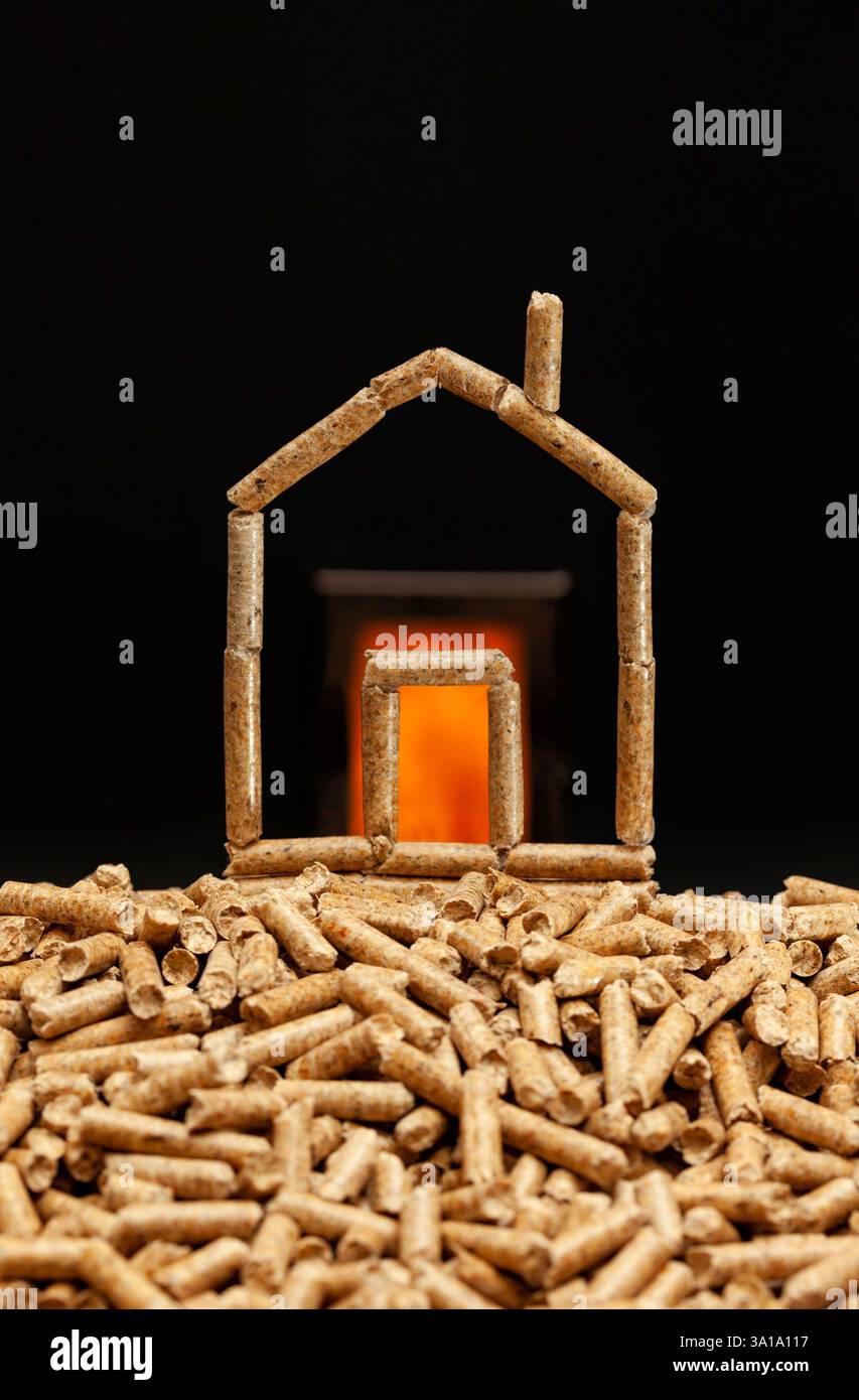 Miniature house made with wood pellets. Heating concept with combustion ...