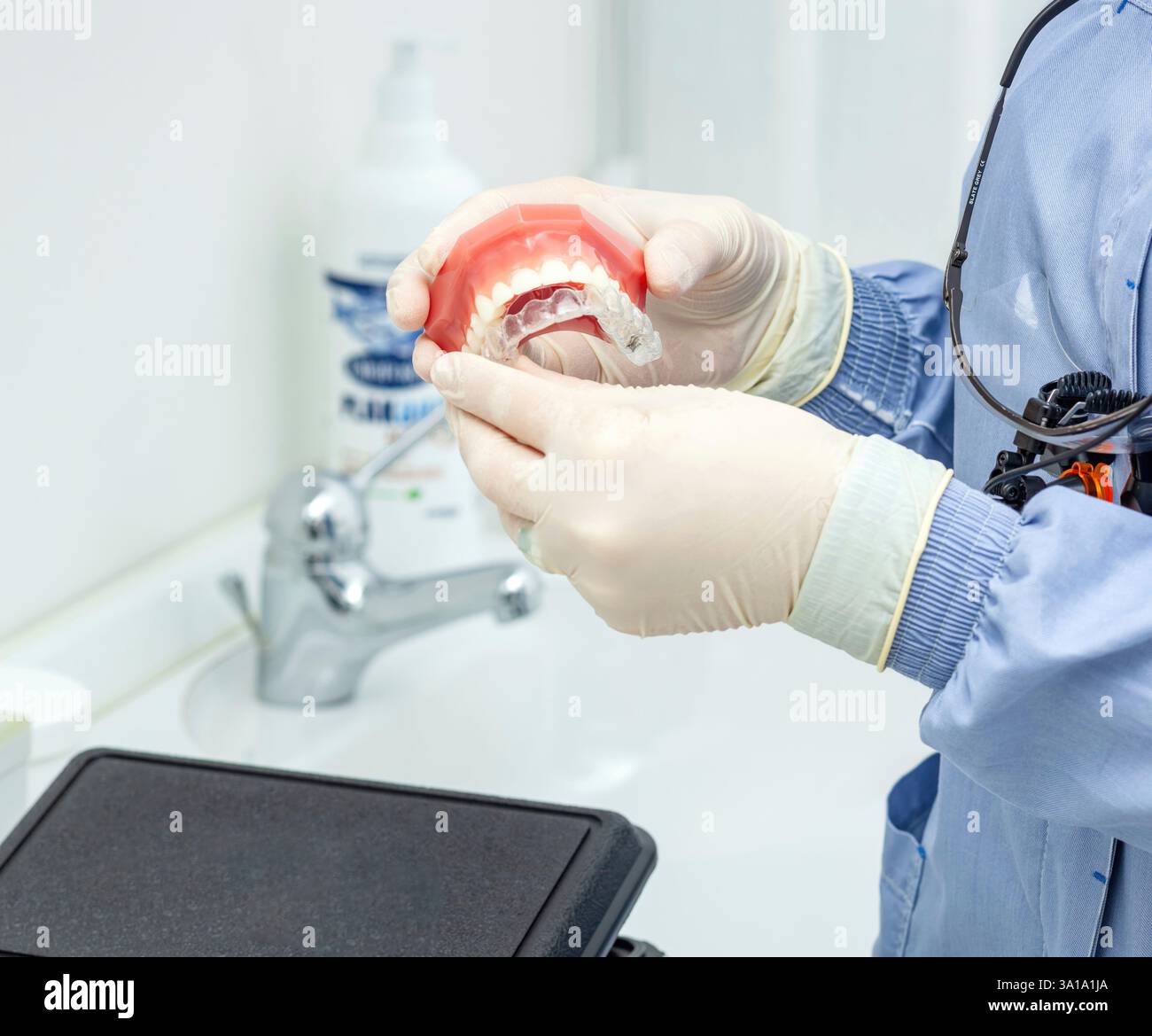 Dentist wearing gloves placing hi-res stock photography and images - Alamy